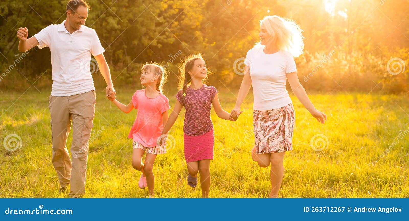 Happy Family Enjoying Life Together at Meadow Outdoor. Stock Image ... Happy Family Enjoying Life Together at Meadow Outdoor. Stock Image ...