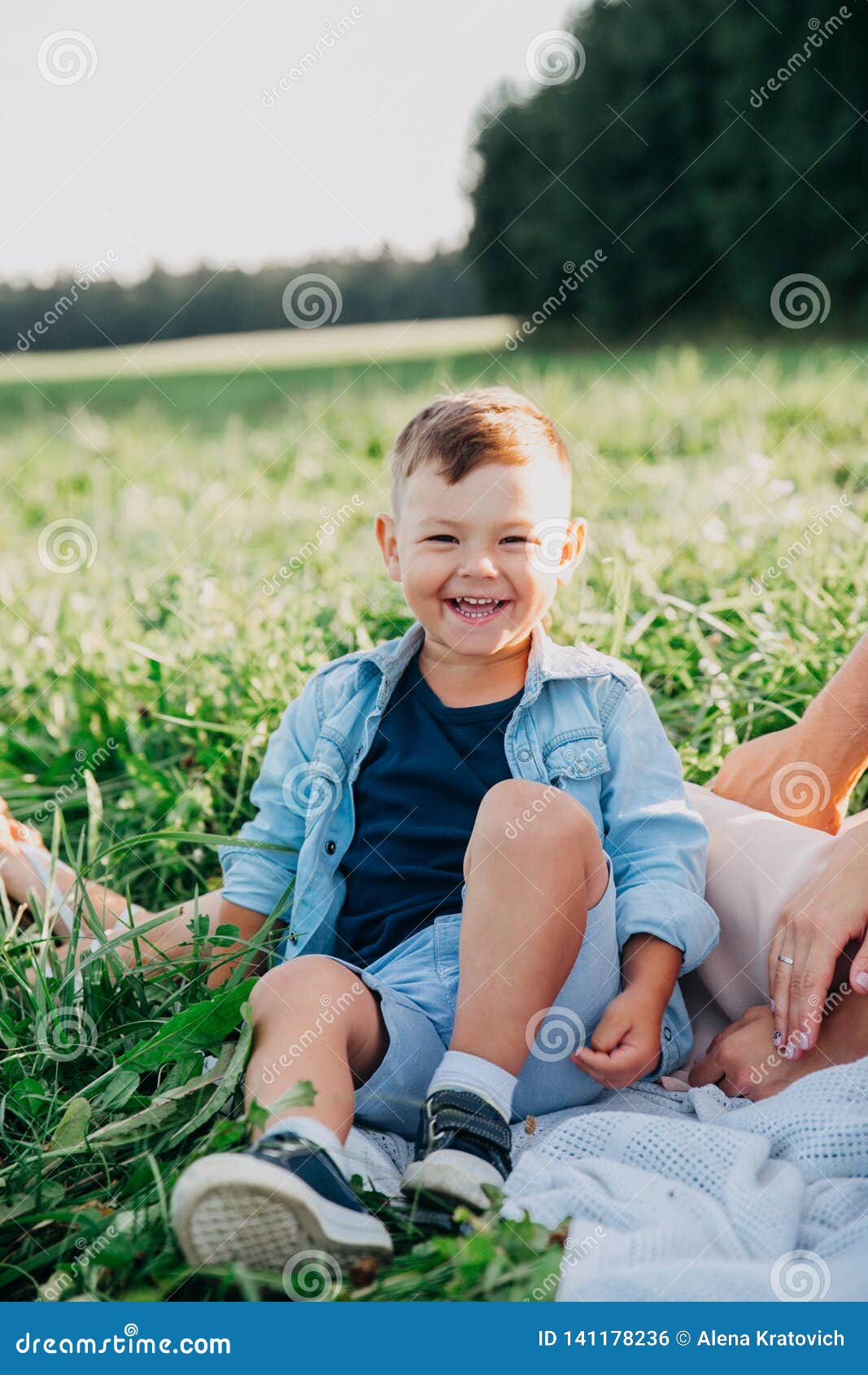 Happy Family Enjoying Together in Summer Day. Little Boy Sitting on ... Happy Family Enjoying Together in Summer Day. Little Boy Sitting on ...