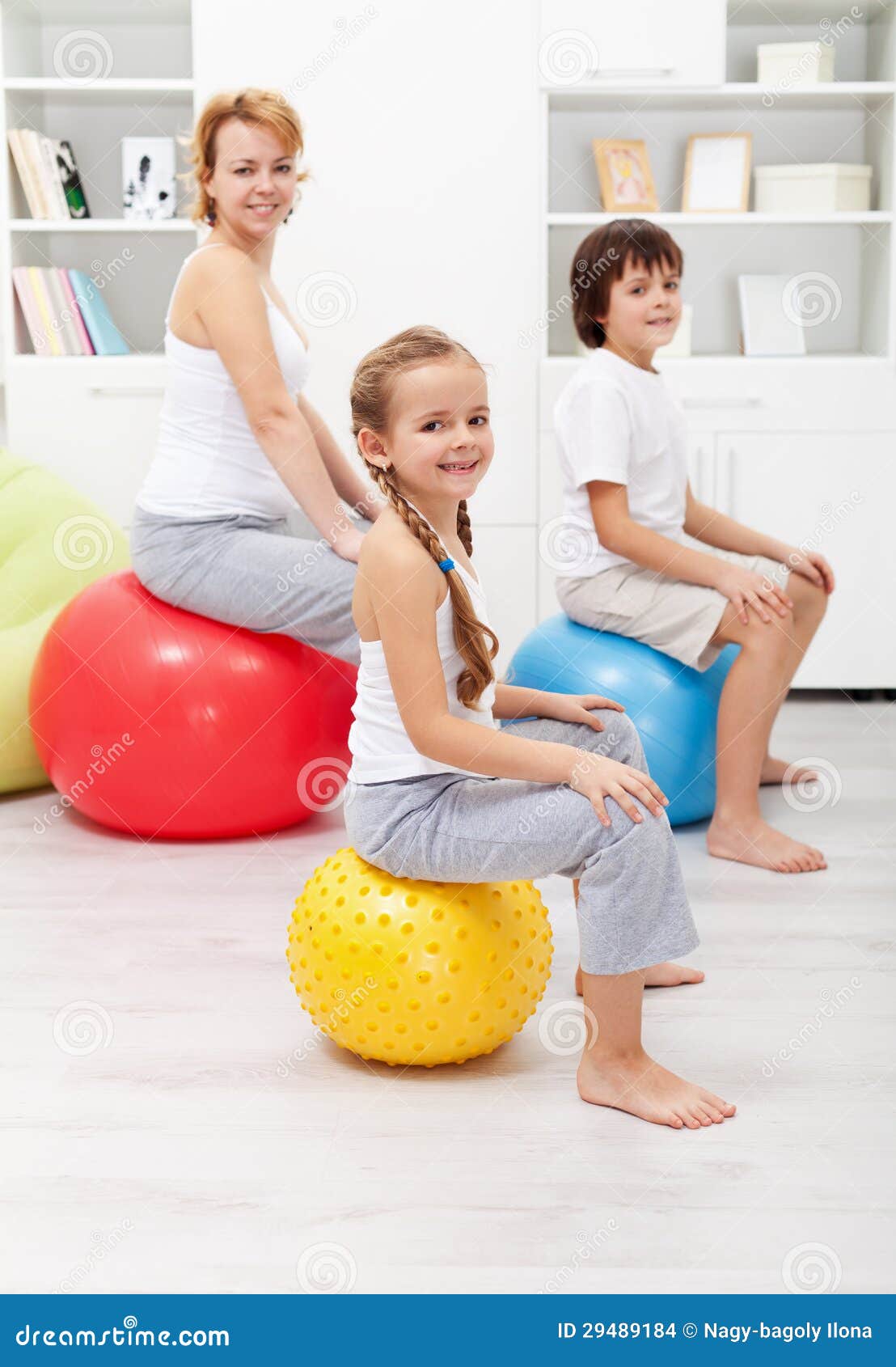 Happy Family Exercising at Home Stock Photo - Image of little, family ...