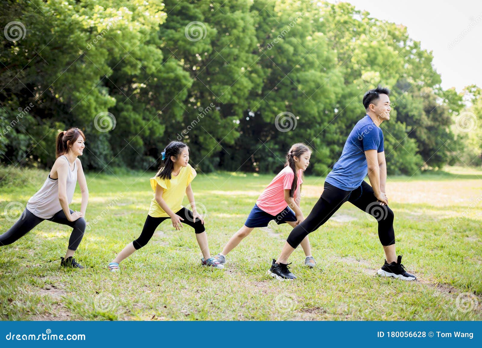 Happy Family Exercising Together at the Park Stock Photo - Image of ...