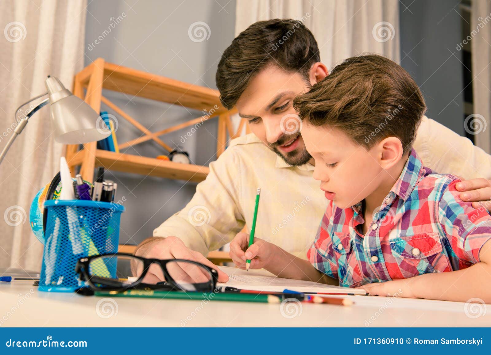 Happy Family. Father and Son Doing Homework Together Stock Photo ...