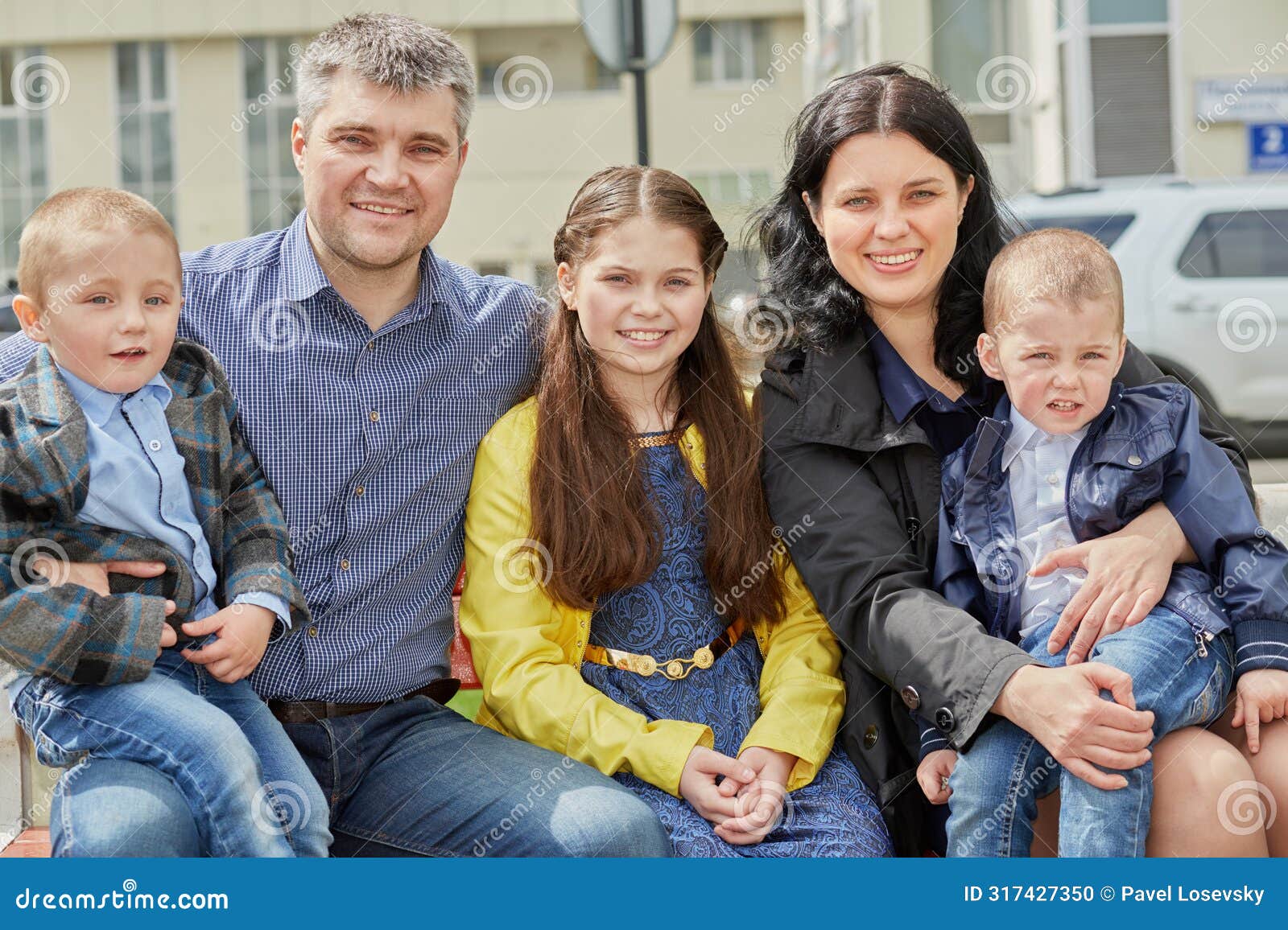 Happy Family of Five Sits on Bench in Stock Photo - Image of people ...