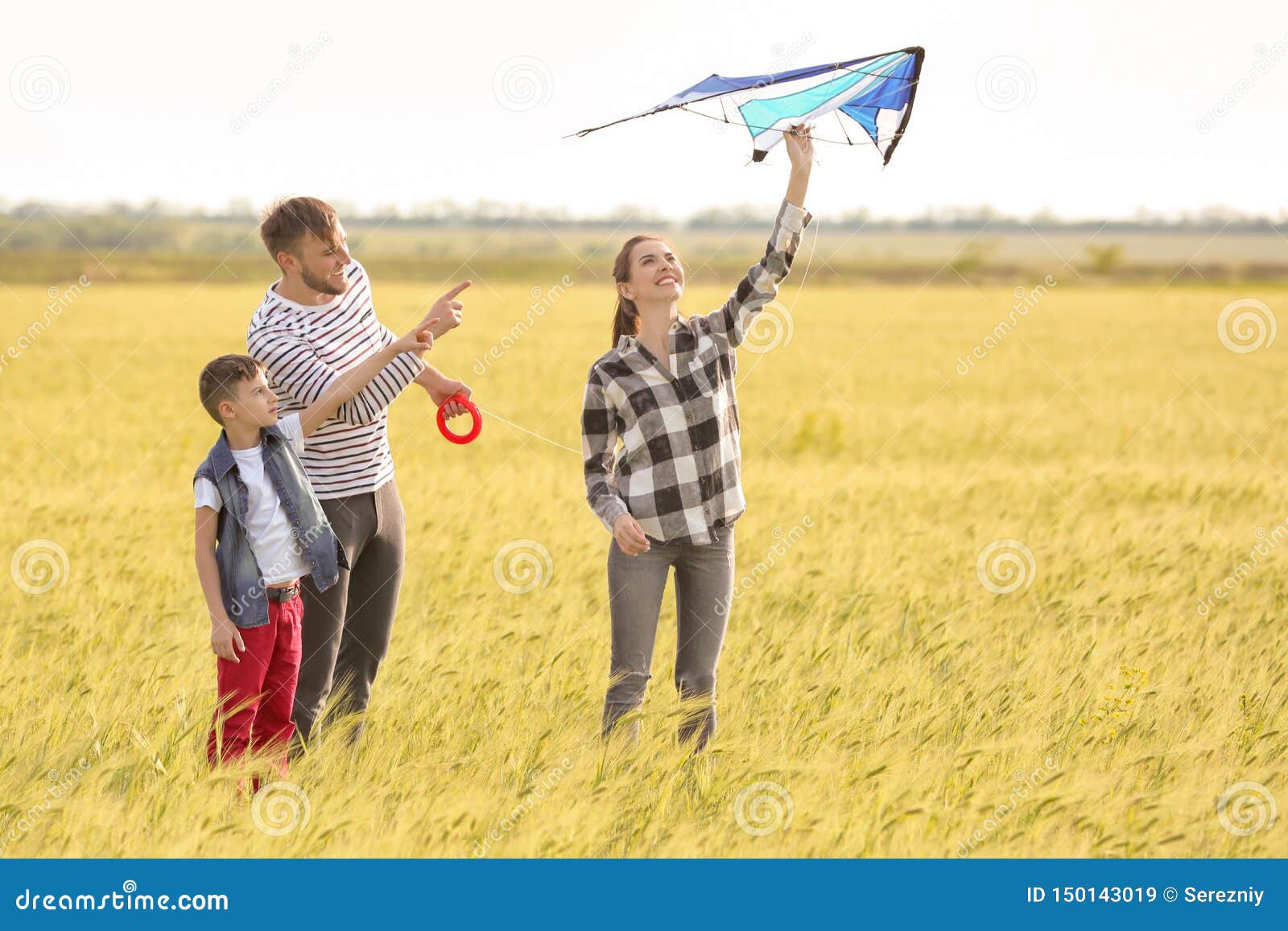 Happy Family Flying Kite in the Field Stock Image - Image of spring ...