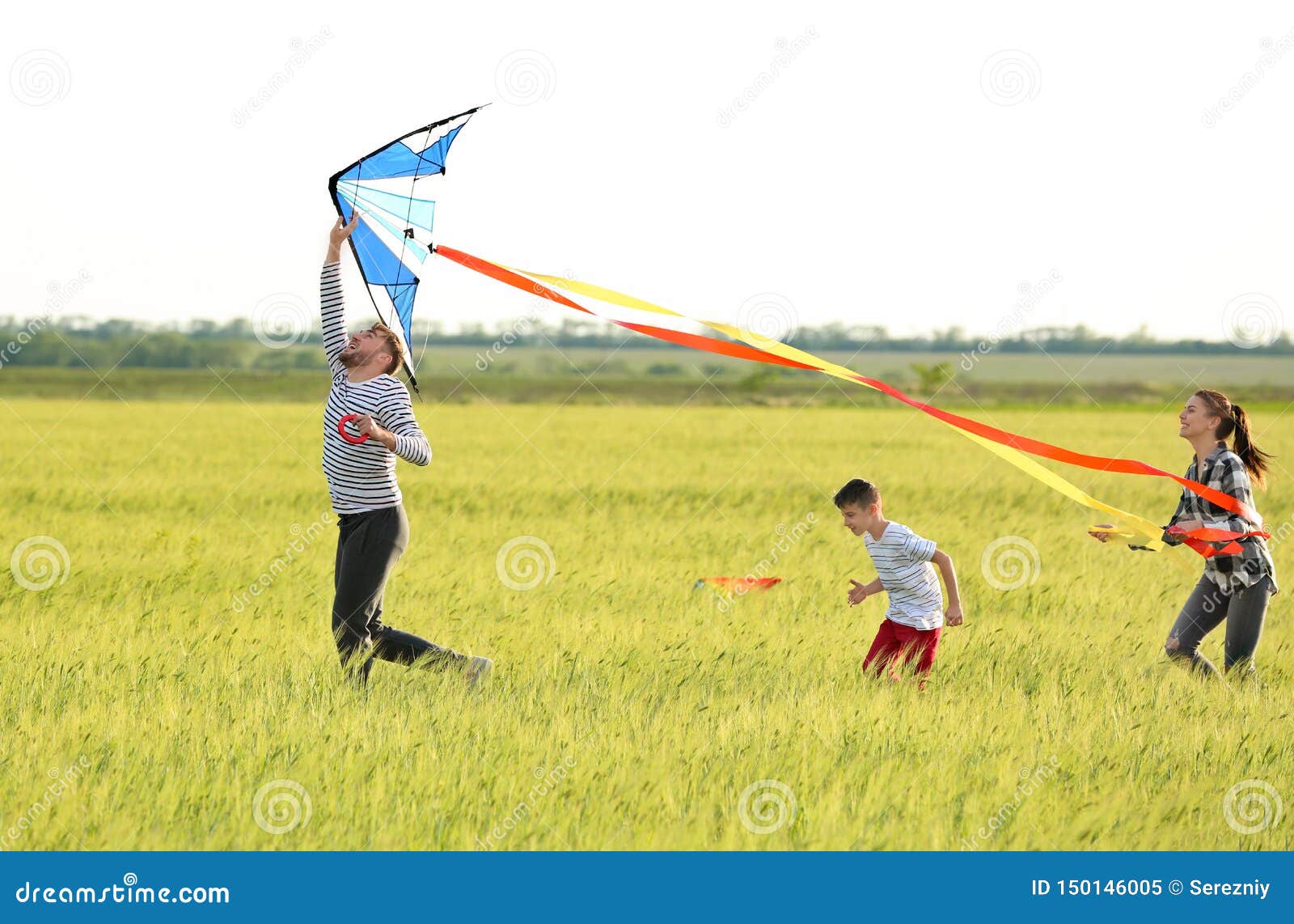 Happy Family Flying Kite in the Field Stock Image - Image of happy ...