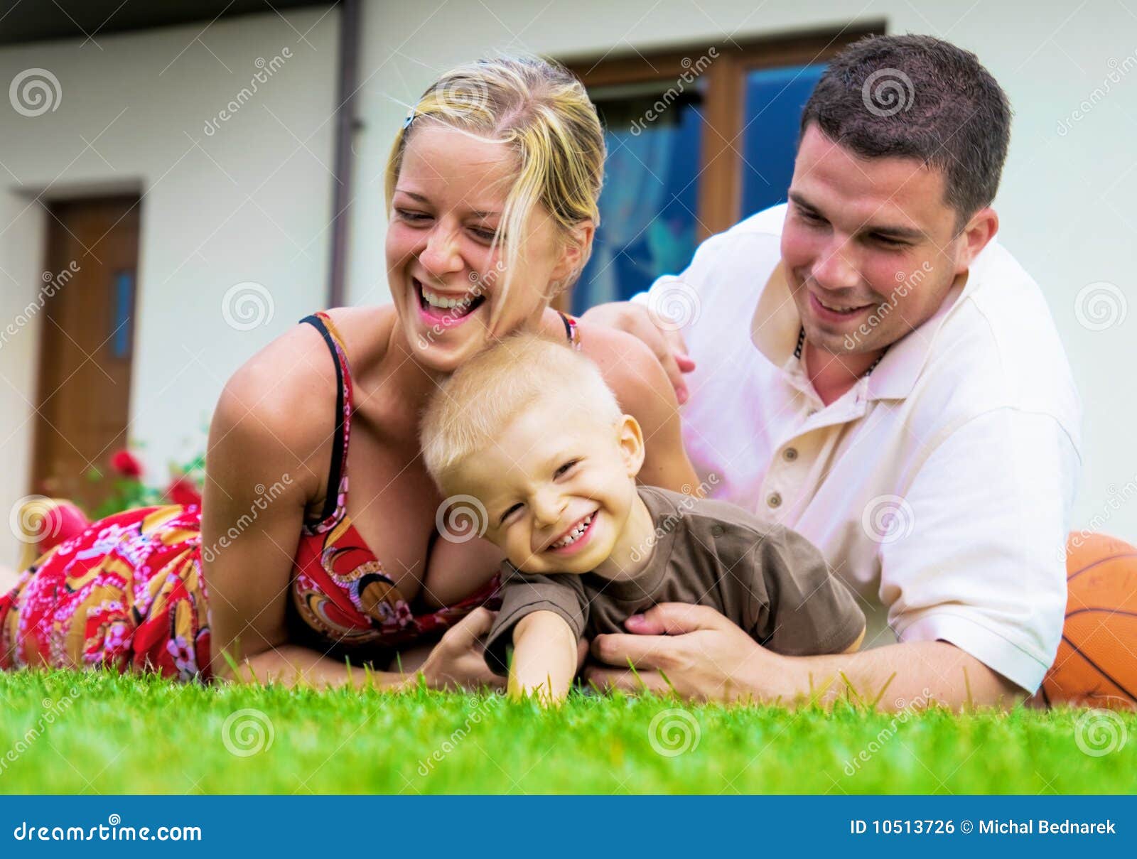 Happy Family in Front of the House Stock Photo - Image of outdoors ...