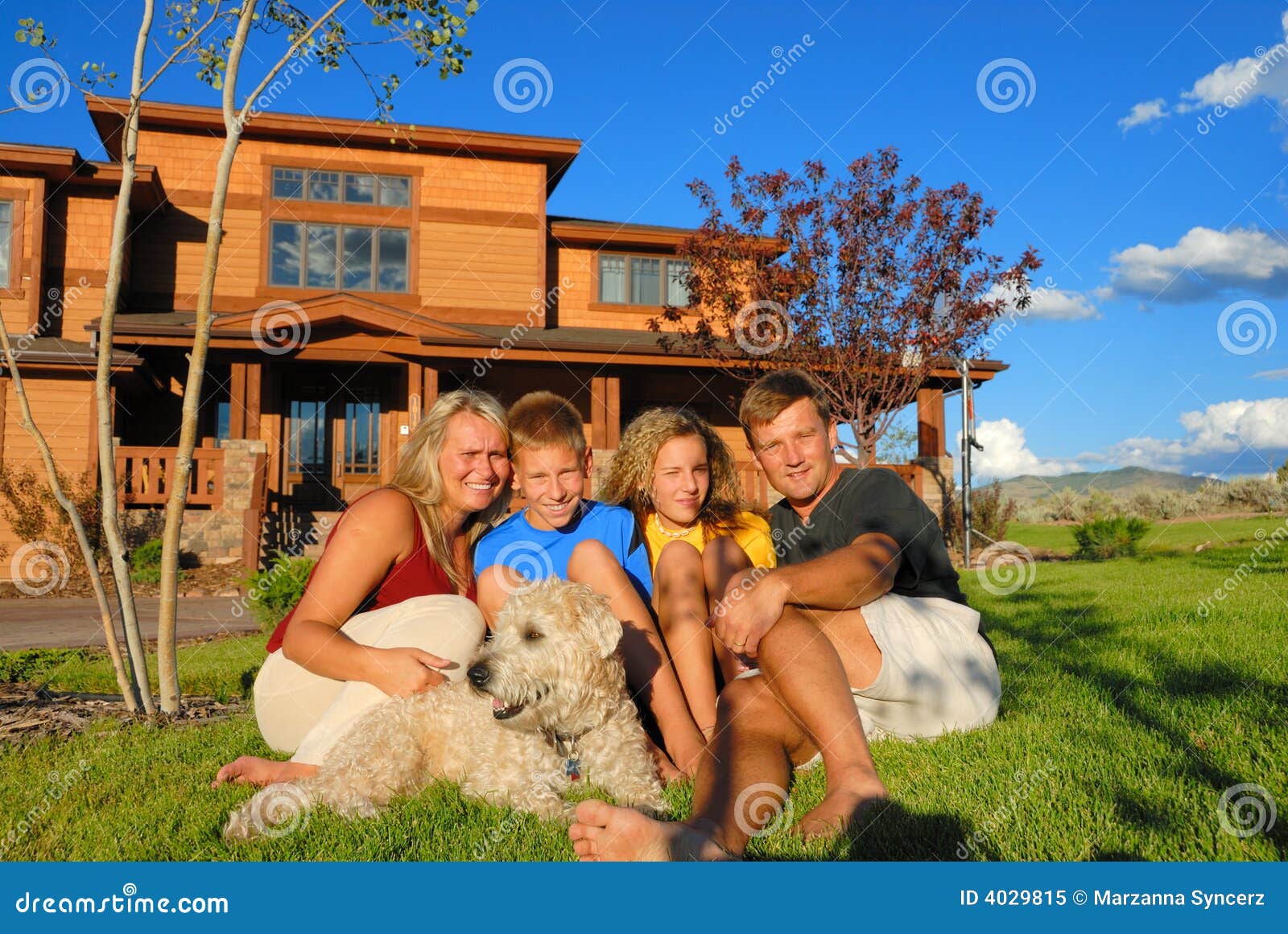 Happy Family in Front of House Stock Image - Image of husband, four ...