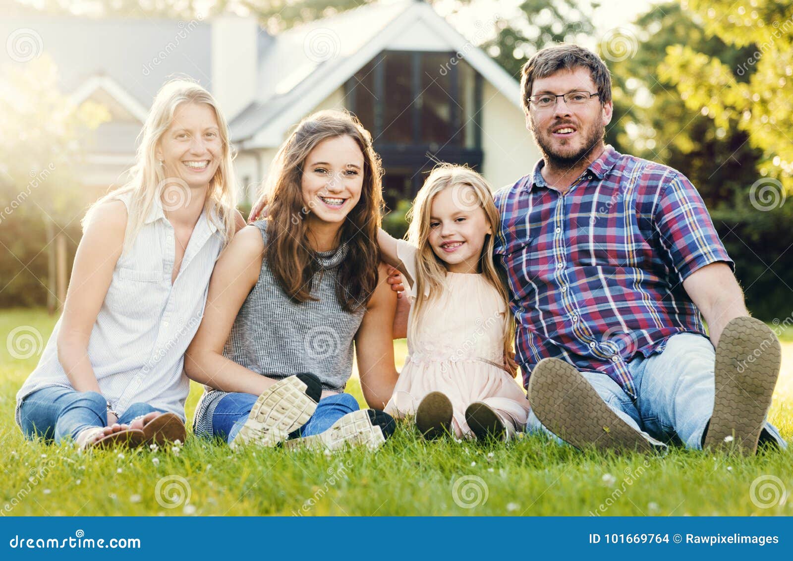 Happy family in the garden stock photo. Image of cheerful - 101669764