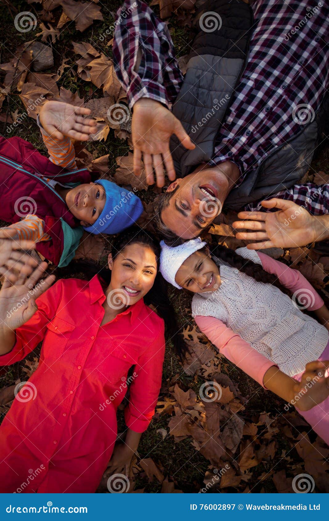 Happy Family Gesturing while Forming Huddle Stock Image - Image of ...