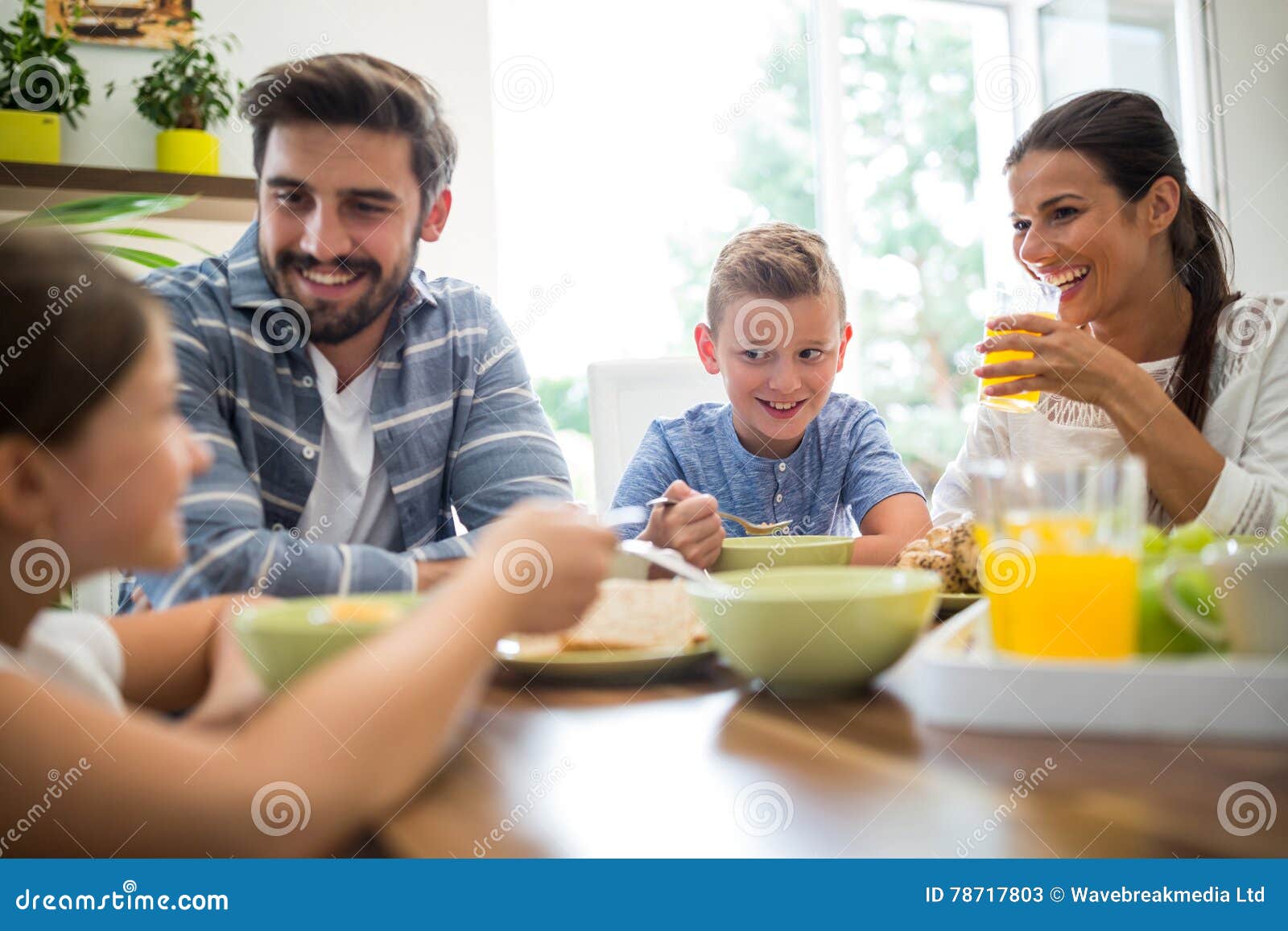 Happy Family Having Breakfast Stock Image - Image of affection, dining ...