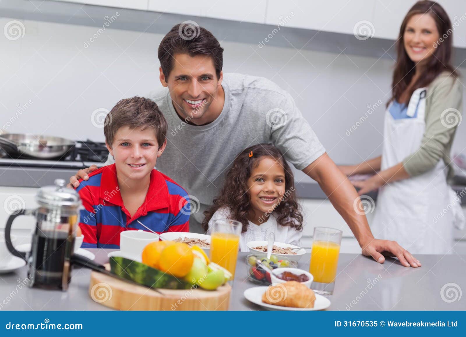 Happy Family Having Breakfast Stock Image - Image of attractive, bowl ...