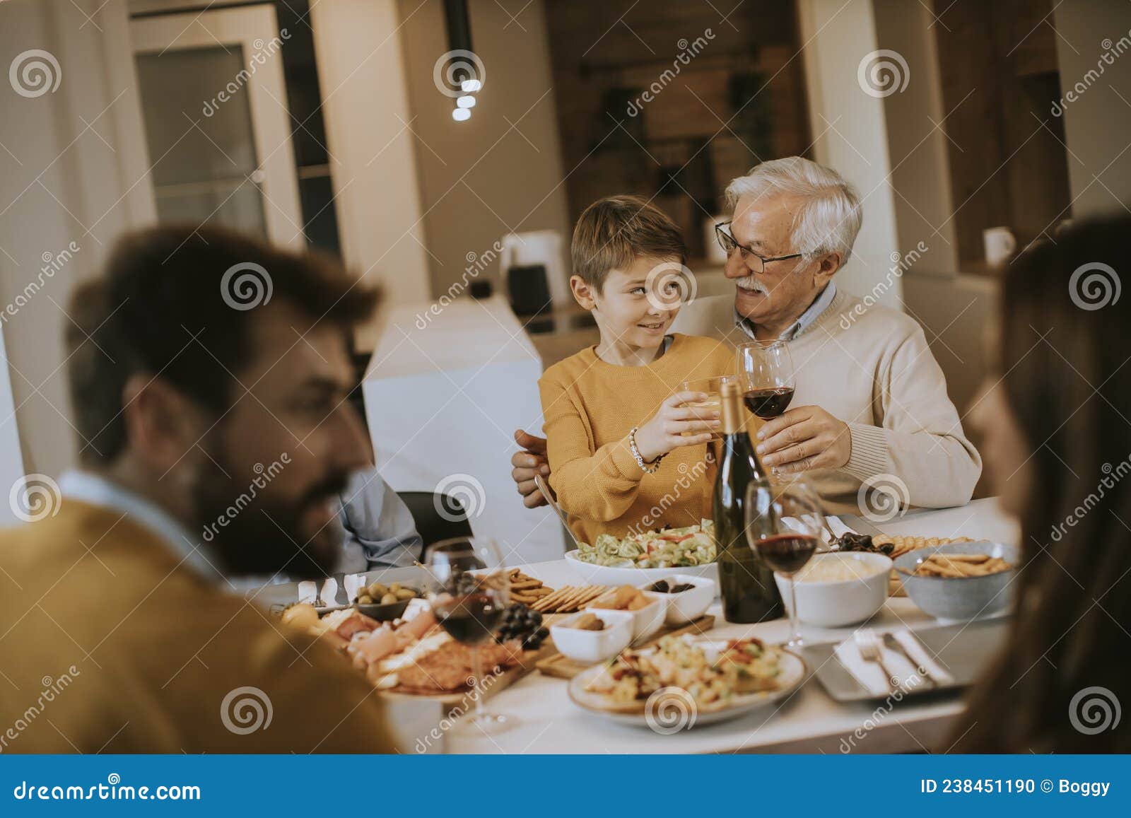 Happy Family Having Dinner with Red Wine at Home Stock Photo - Image of ...