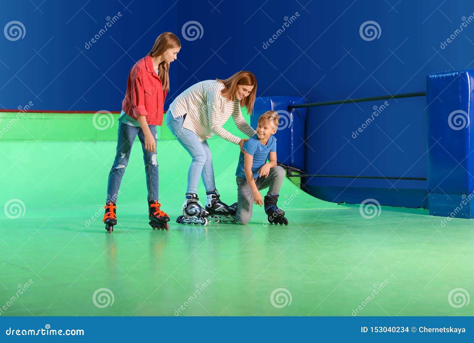 Happy Family Having Fun at Roller Rink Stock Photo - Image of parent ...