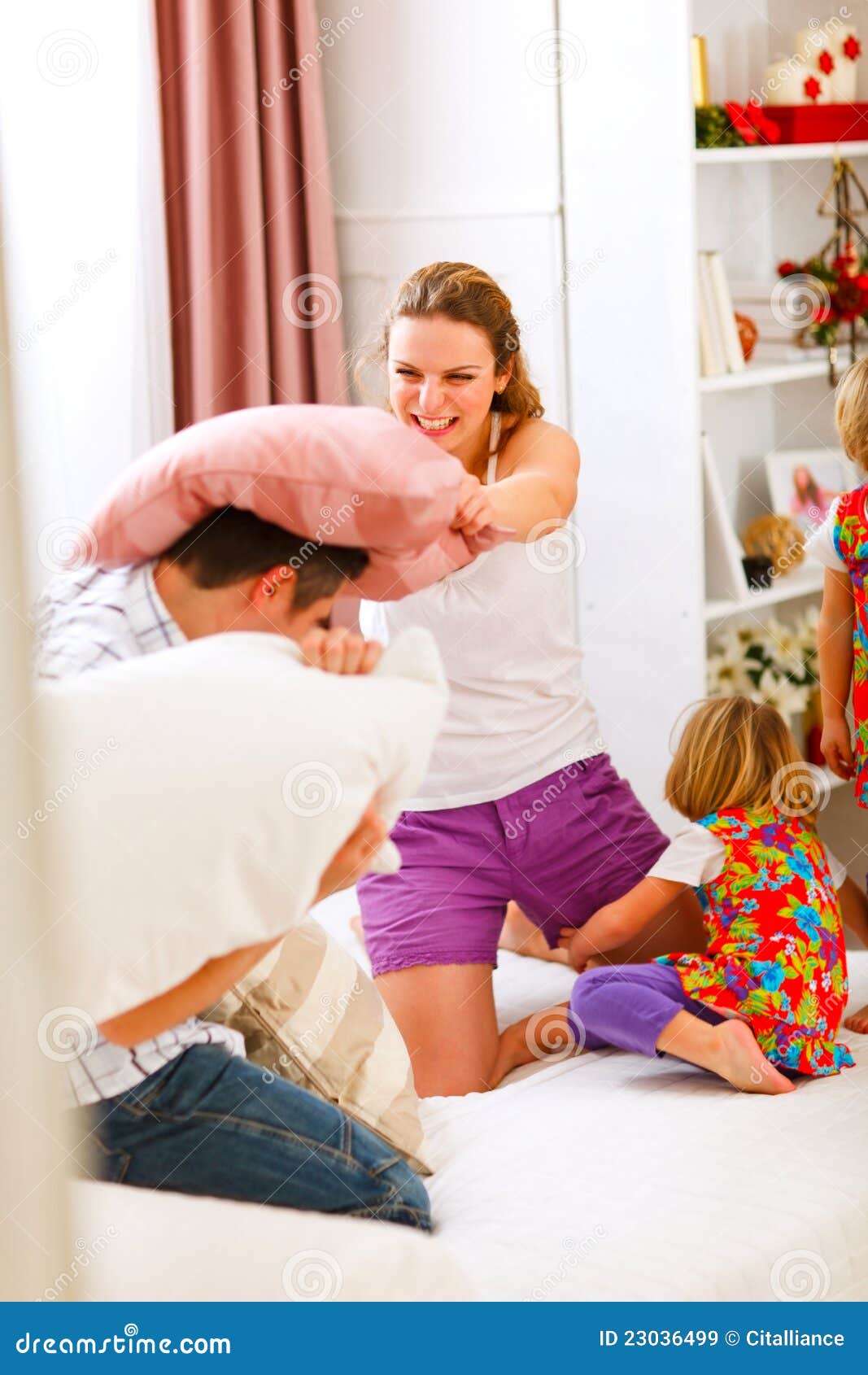 Happy Family Having Pillow Fight in Bed Stock Image - Image of cheerful ...
