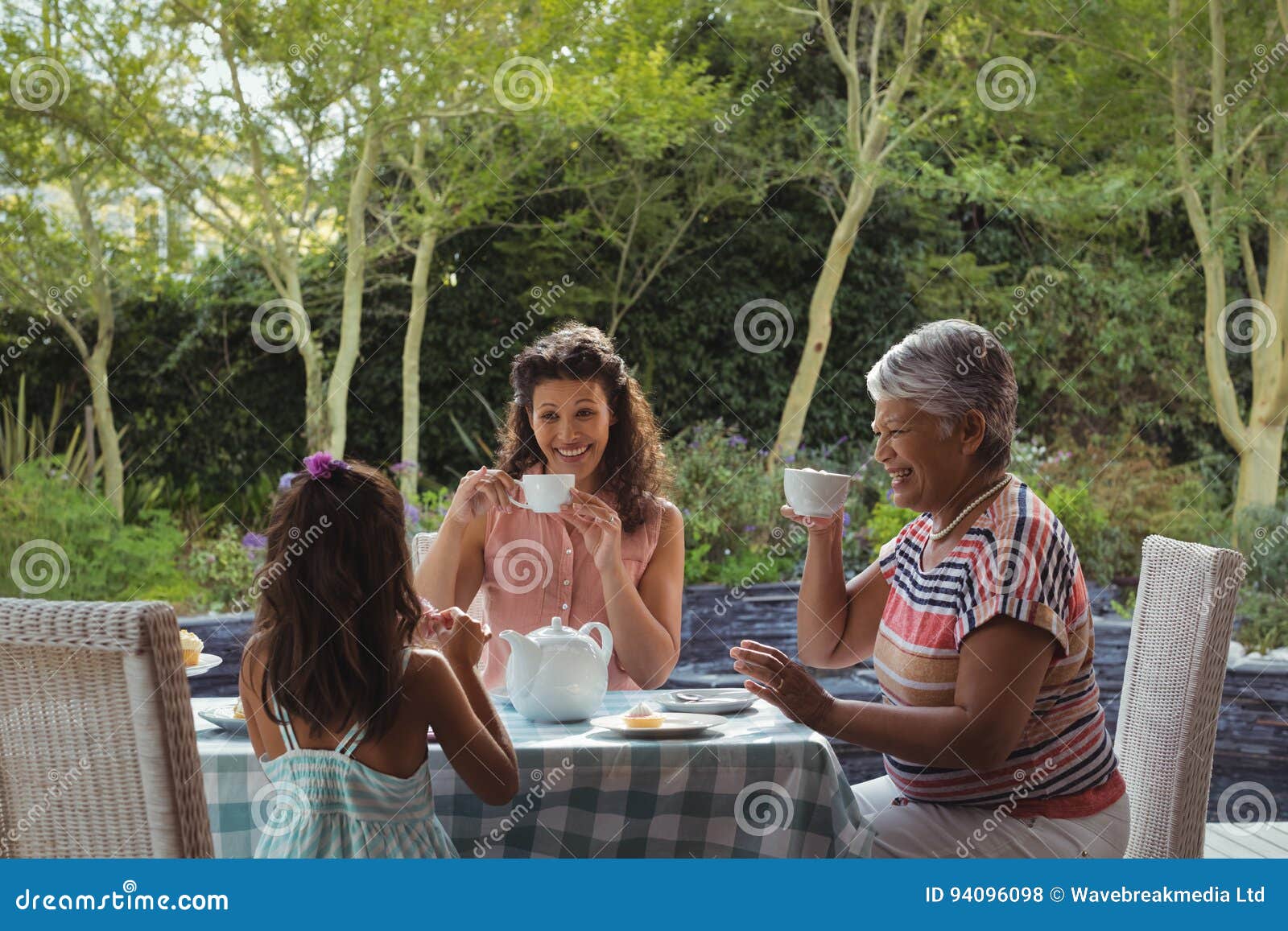 Happy family having tea stock photo. Image of child, casual - 94096098