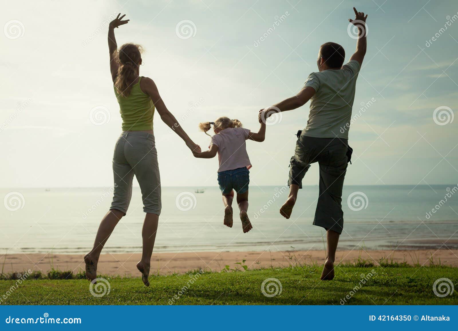 Happy Family Jumping on the Beach Stock Photo - Image of silhouette ...