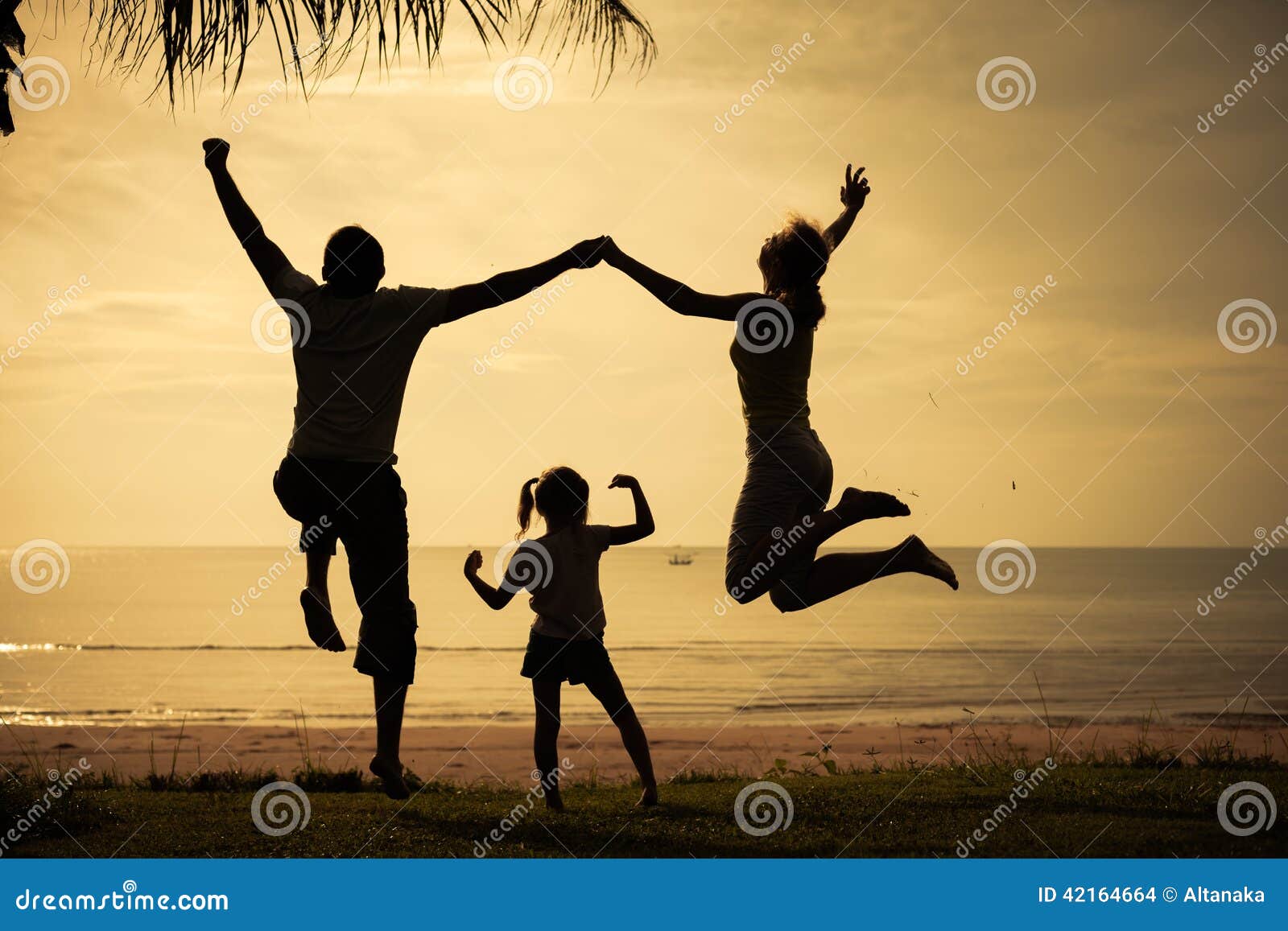 Happy Family Jumping on the Beach on the Dawn Time Stock Photo - Image ...