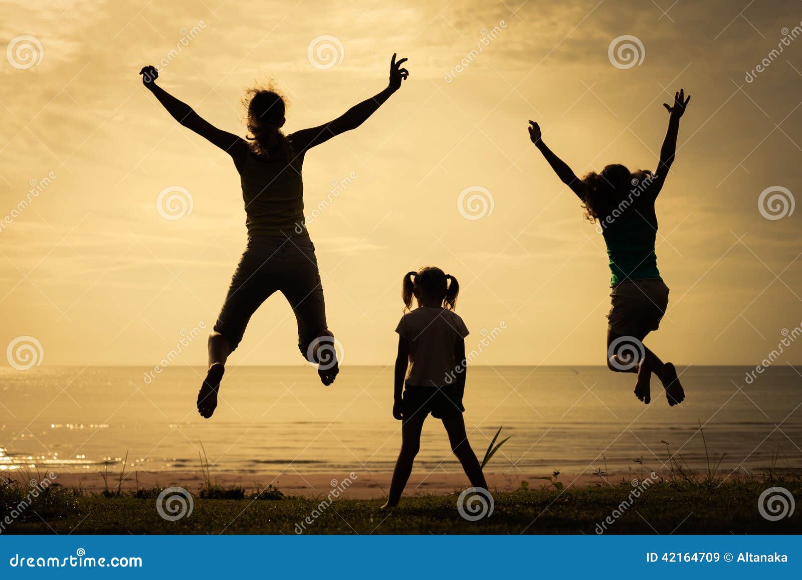 Happy Family Jumping on the Beach Stock Image - Image of back, girl ...