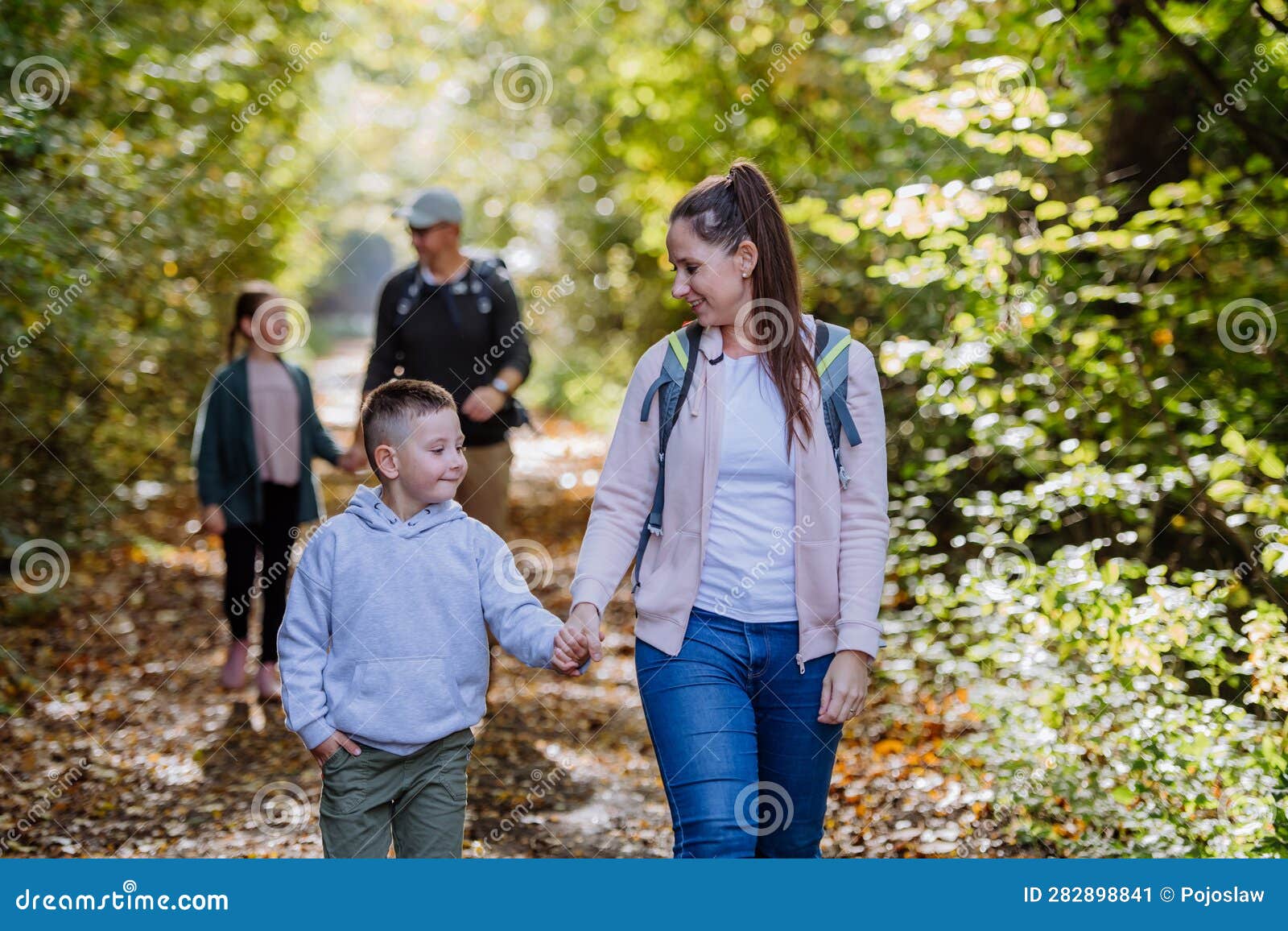 Happy Family with Kids Walking in Forest. Stock Image - Image of ...