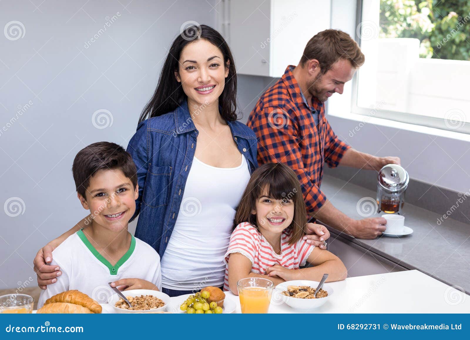 Happy family in kitchen stock image. Image of bonding - 68292731