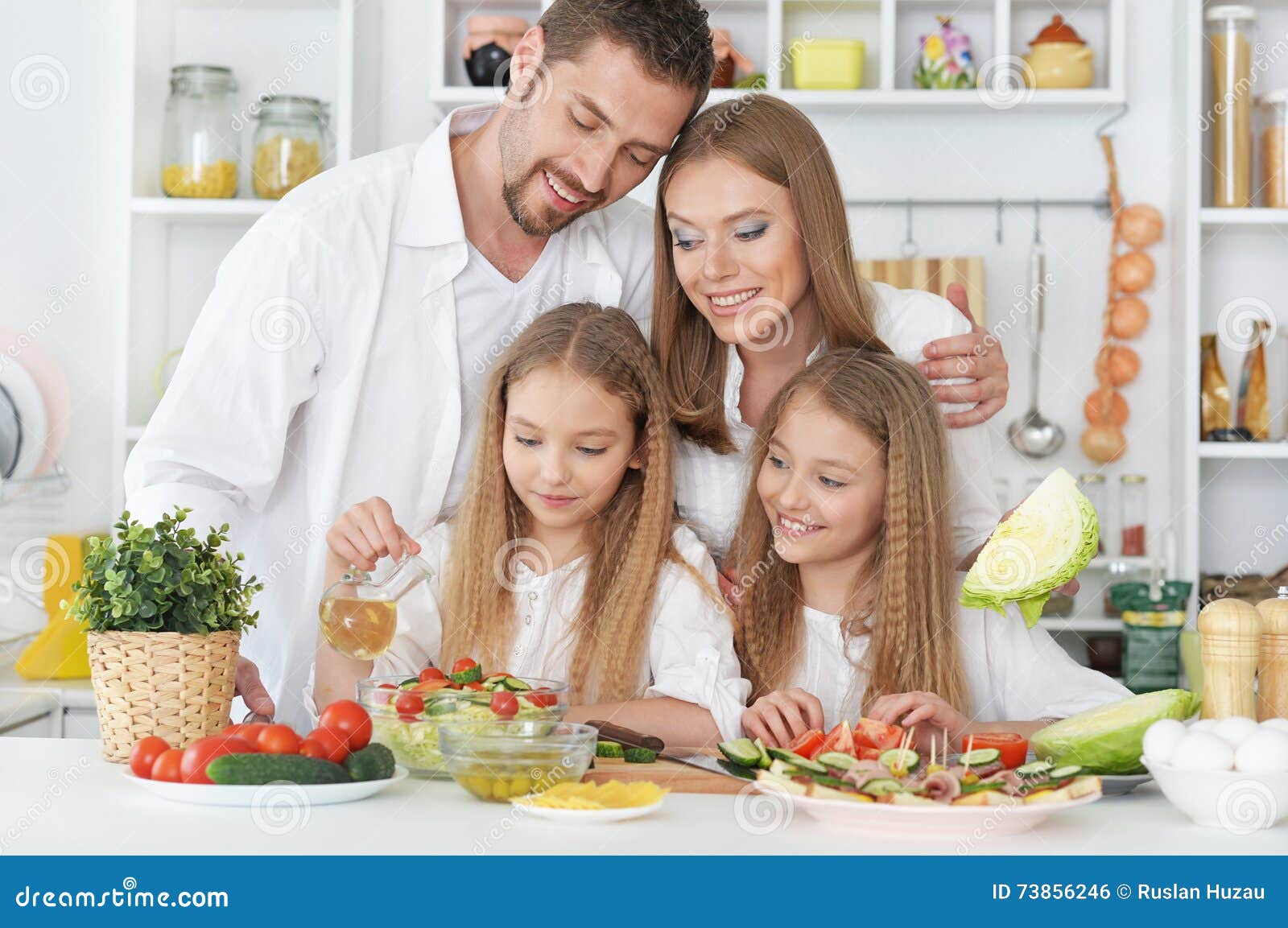 Happy family at kitchen stock photo. Image of emotional - 73856246