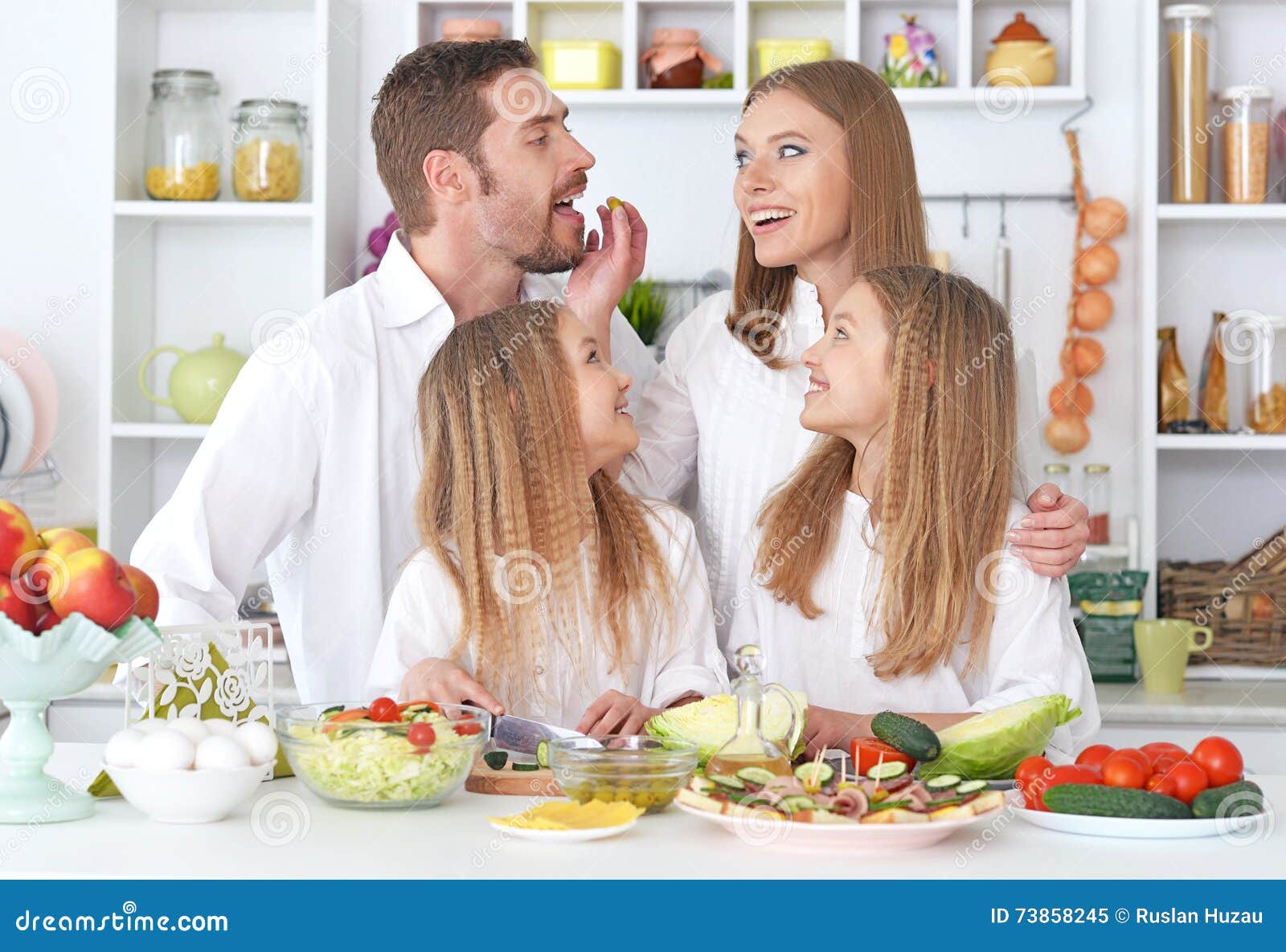 Happy family at kitchen stock image. Image of male, expression - 73858245