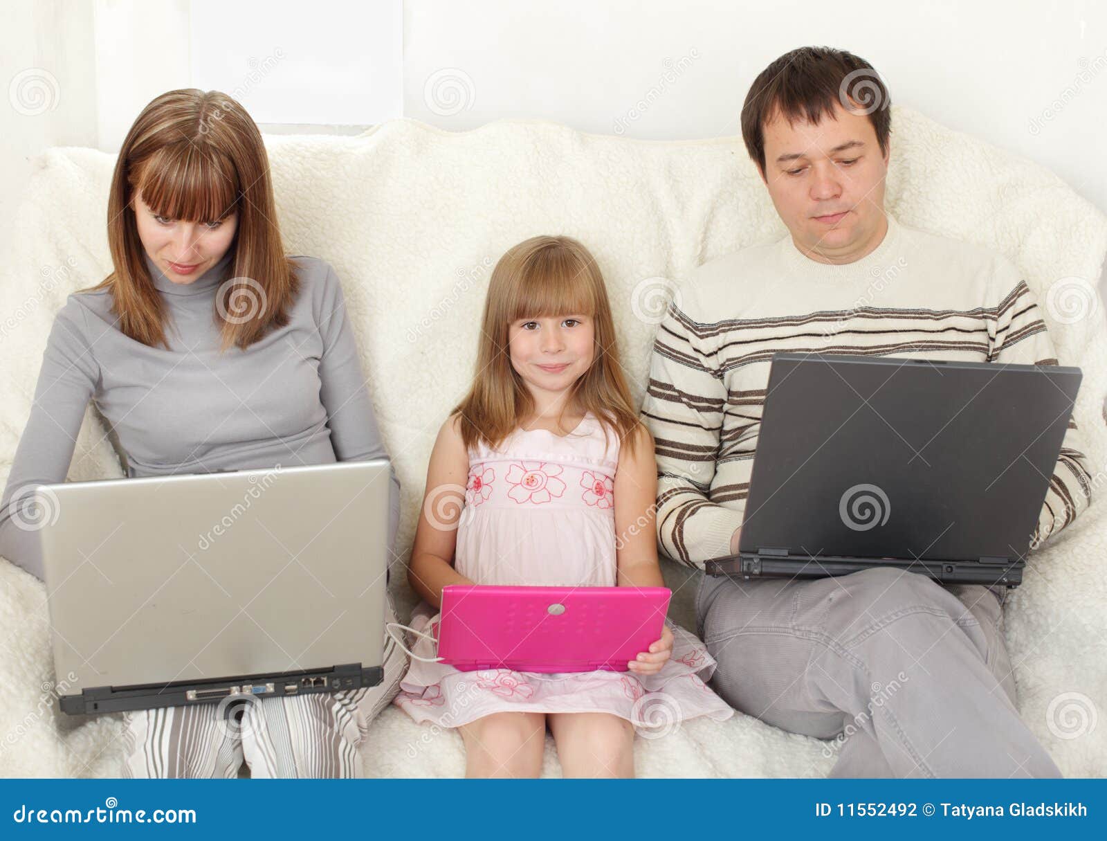 Happy family with laptop stock photo. Image of living - 11552492
