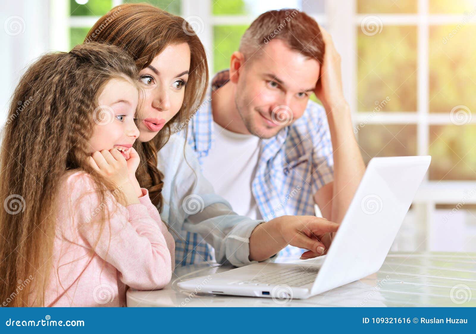 Happy family with laptop stock photo. Image of family - 109321616
