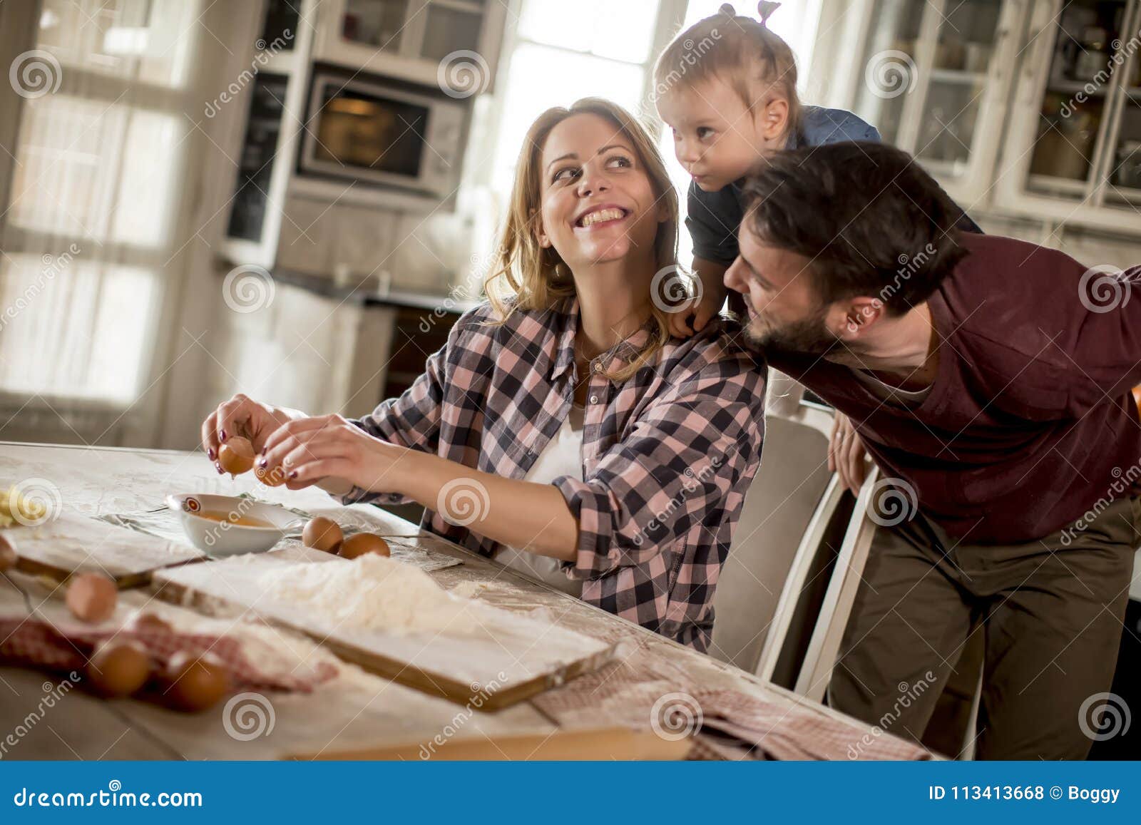 Happy Family Making Pasta in the Kitchen at Home Stock Photo - Image of ...