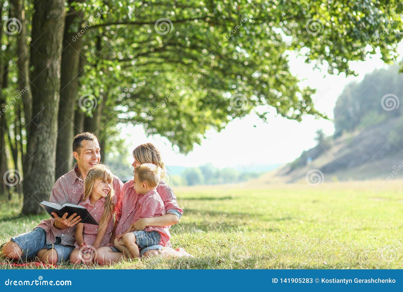 Happy family in nature stock image. Image of nature - 141905283
