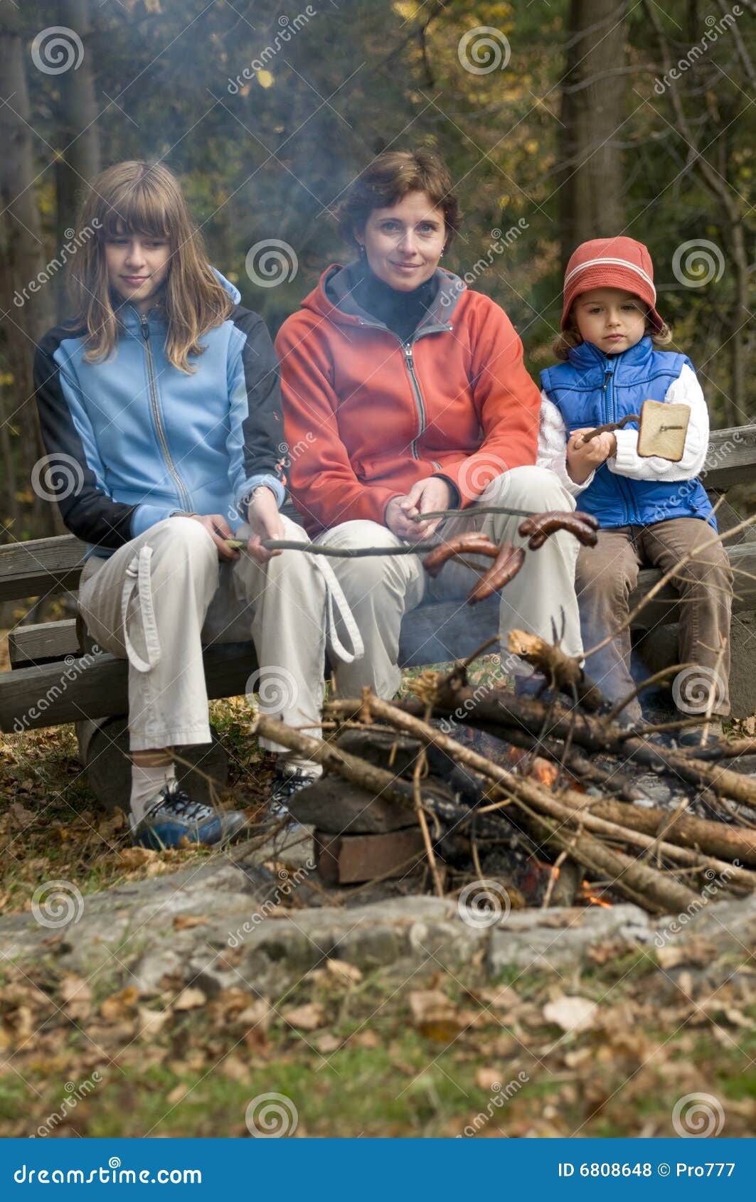 Happy family near campfire stock photo. Image of bread - 6808648