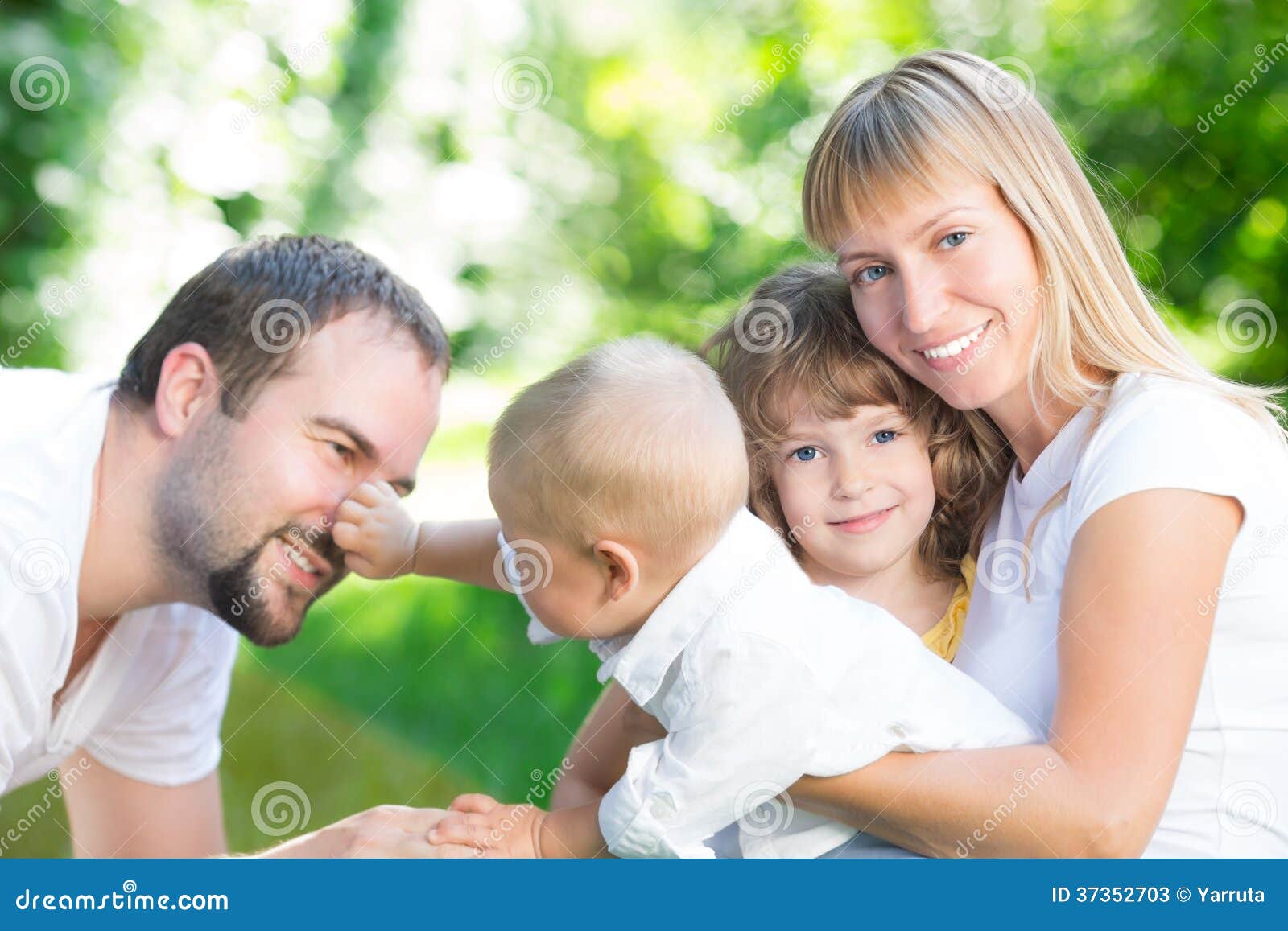 Happy family outdoors stock image. Image of parents, four - 37352703