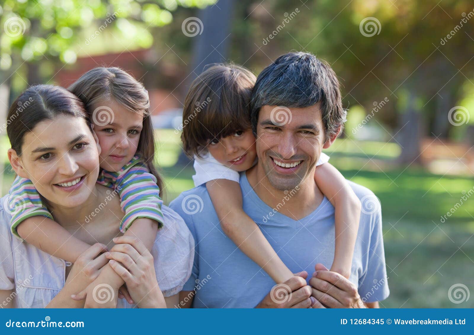 Happy family in the park stock image. Image of caucasian - 12684345