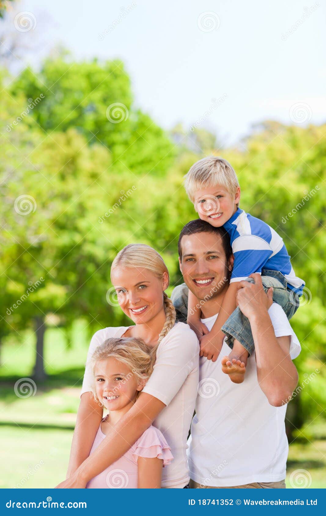 Happy family in the park stock photo. Image of happy - 18741352
