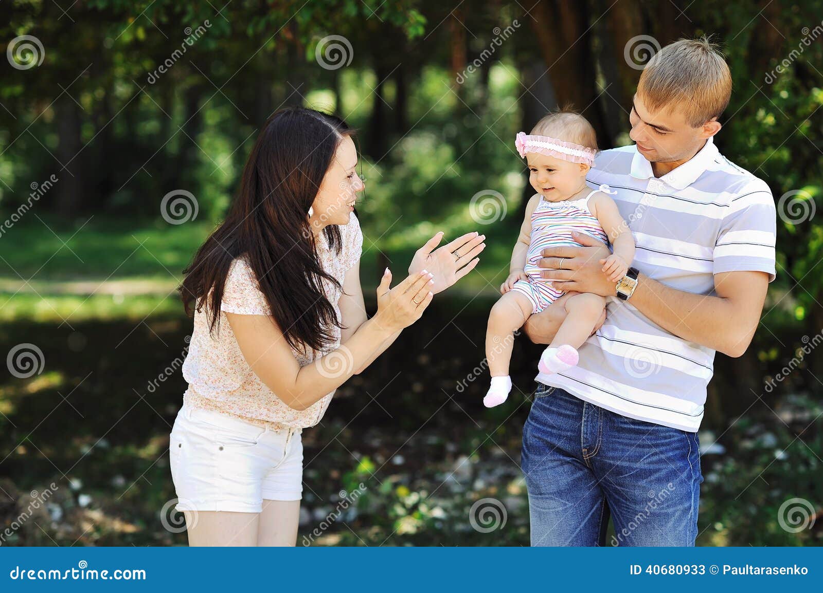 Happy family in a park stock image. Image of cute, laughing - 40680933