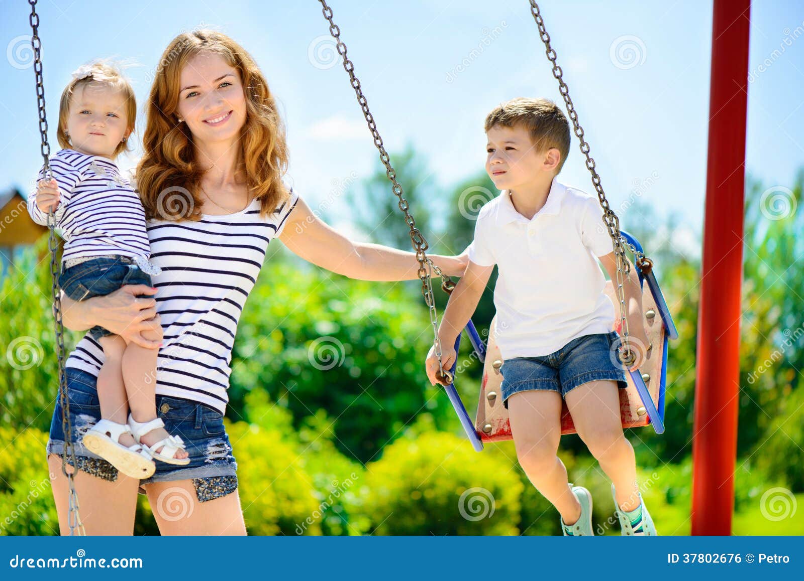 Happy family on playground stock photo. Image of mother - 37802676