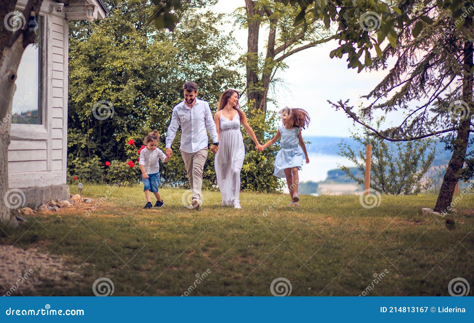 Family playing in backyard stock image. Image of ethnicity - 214813167
