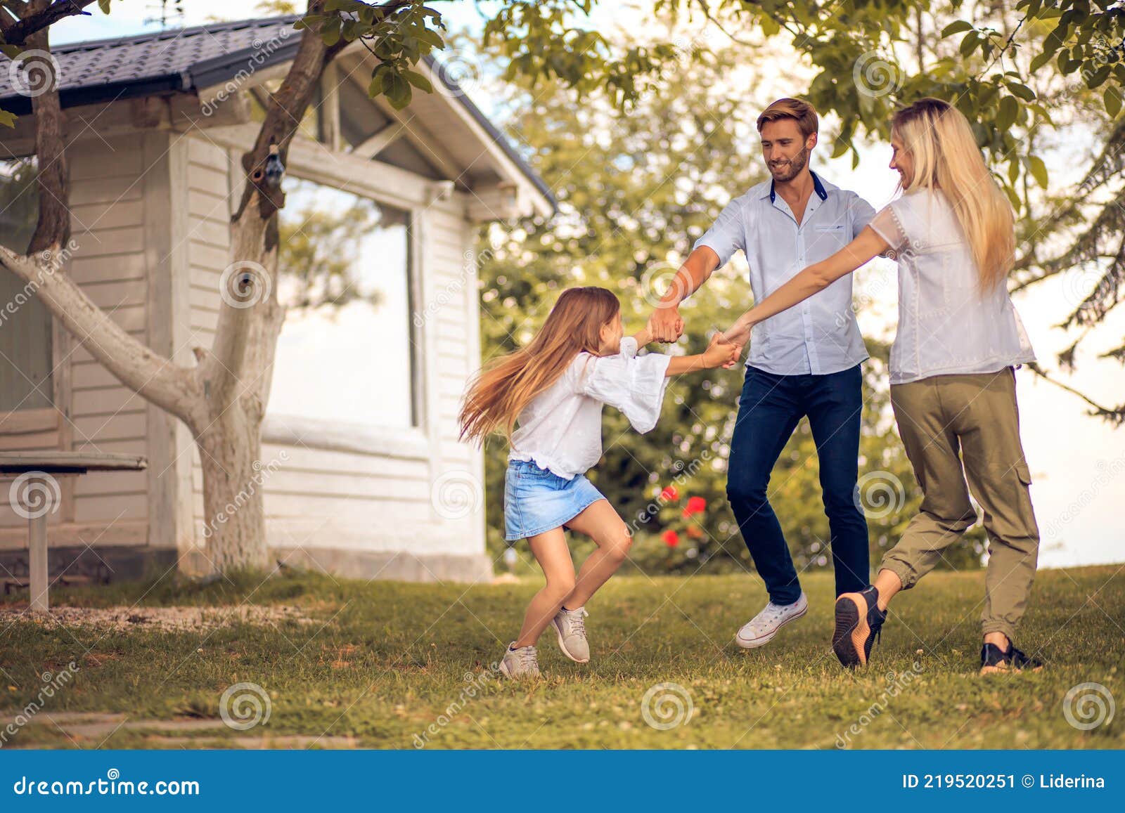 Family playing in backyard stock image. Image of child - 219520251