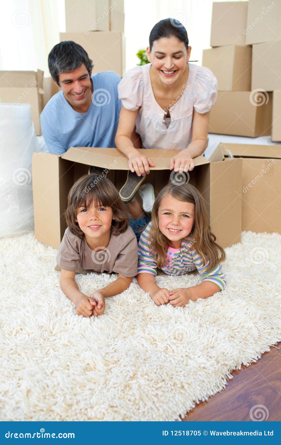 Happy Family Playing with Boxes Stock Image - Image of couple, family ...