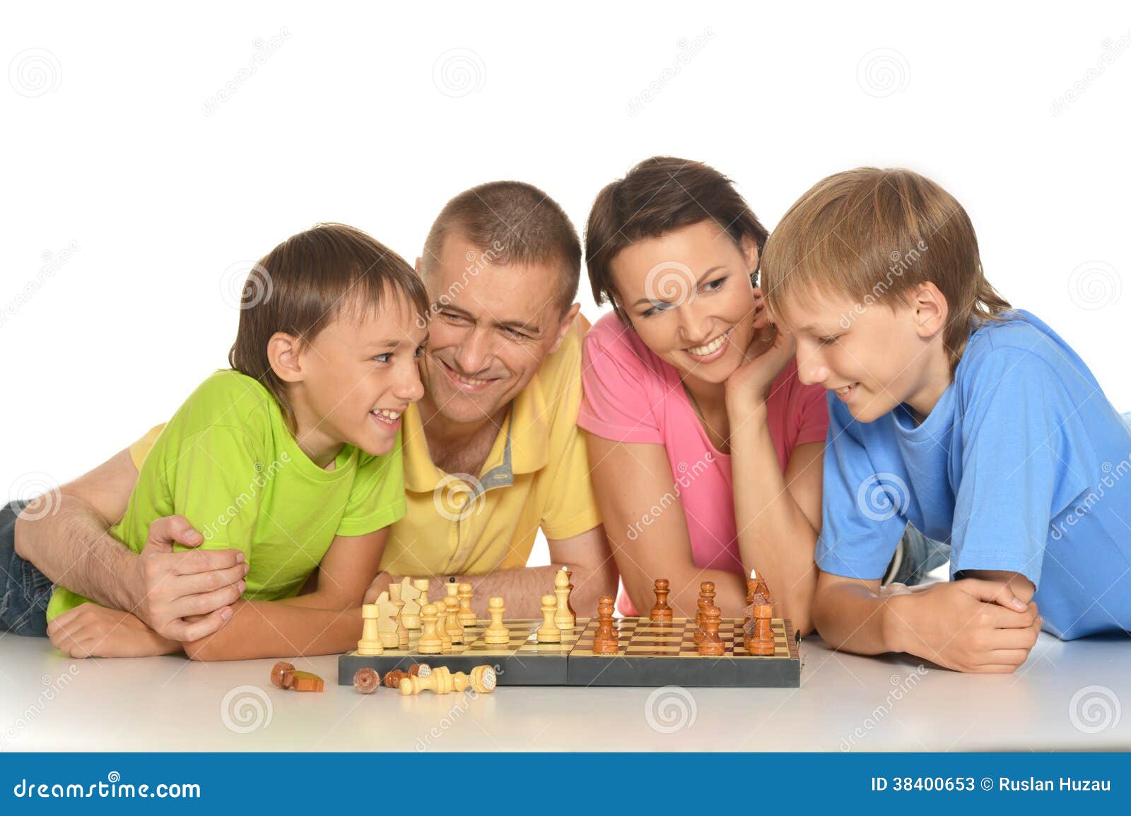Happy family playing chess stock image. Image of intelligence - 38400653