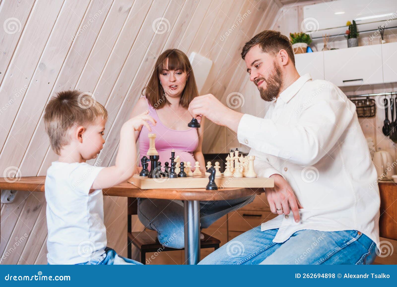 Happy Family Playing Chess in the Kitchen Stock Photo - Image of male ...