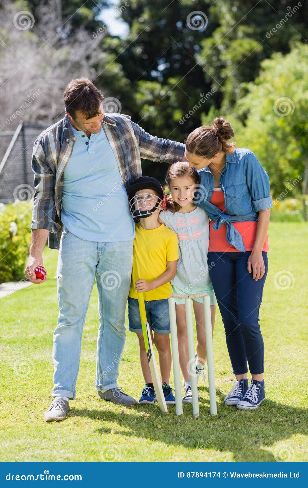 Happy Family Playing Cricket Together in Backyard Stock Photo - Image ...