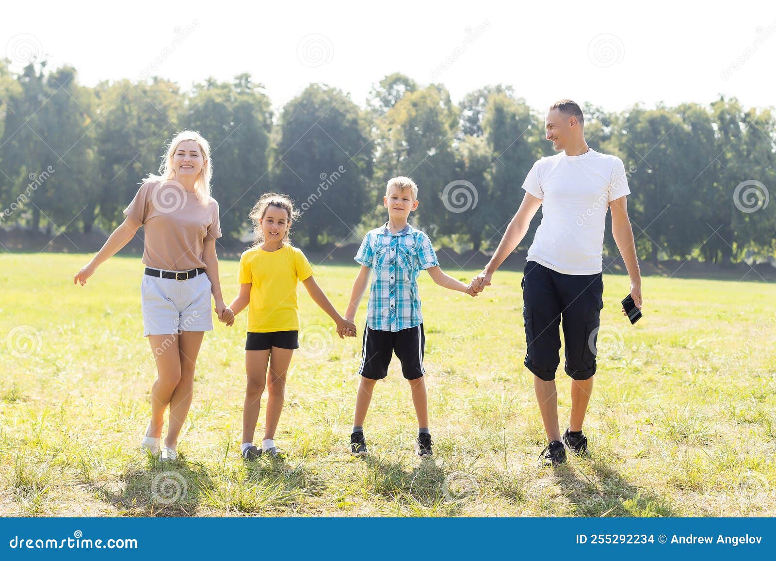 Happy Family Playing in the Green Field Stock Photo - Image of walk ...