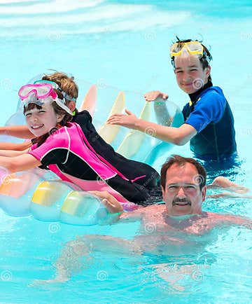 Happy Family Playing in Pool Stock Image - Image of cute, looking: 20339983