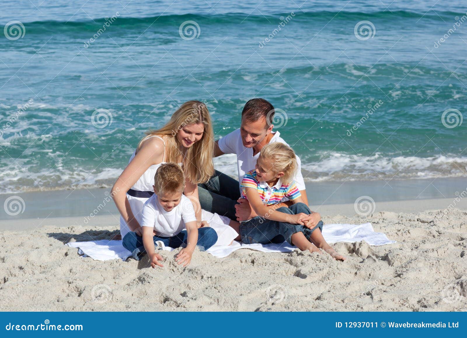 Happy Family Playing on the Sand Stock Image - Image of parent ...