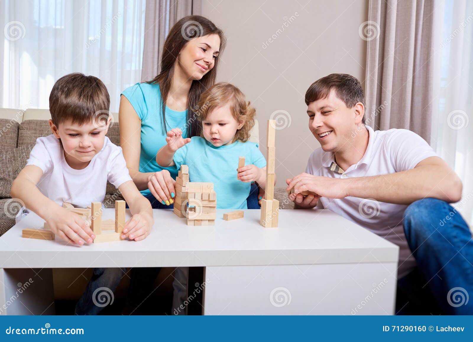 Happy Family Playing Together at Home Stock Photo - Image of game ...