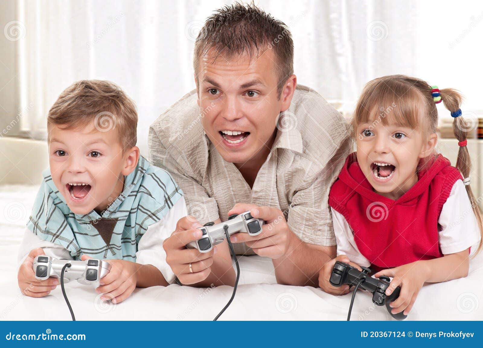 Happy Family Playing a Video Game Stock Photo - Image of excited, male ...