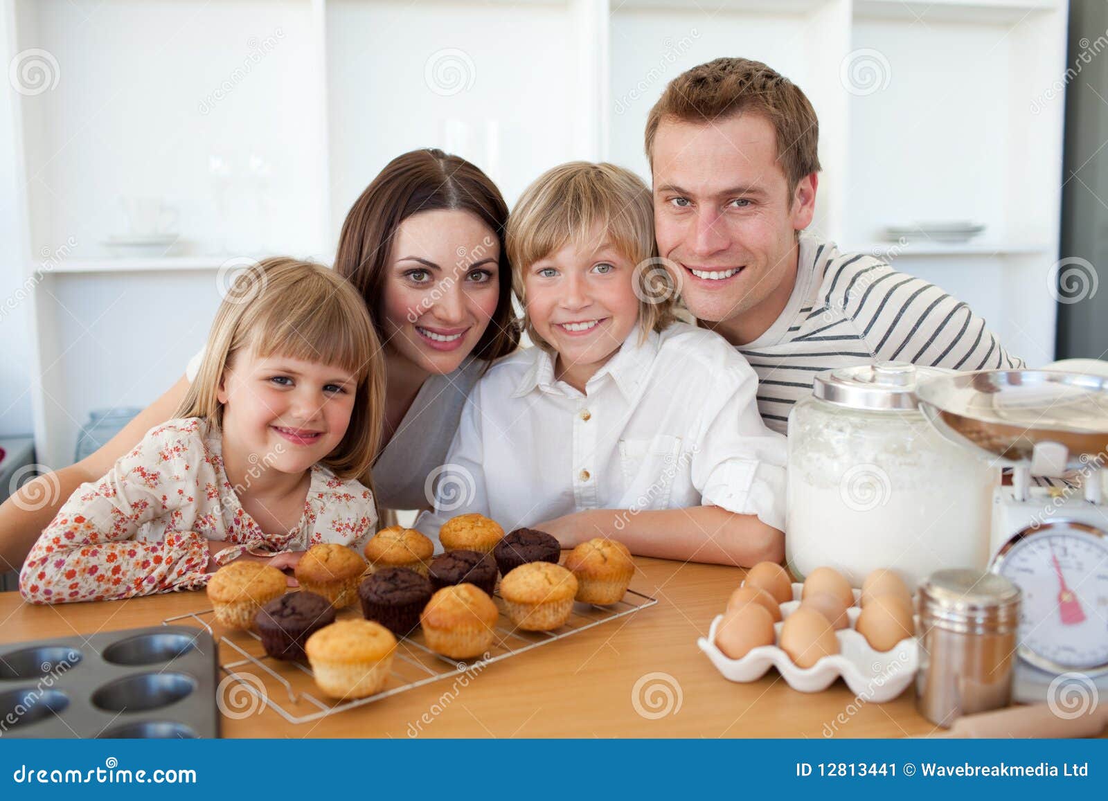 Happy Family Presenting Their Muffins Stock Image - Image of little ...