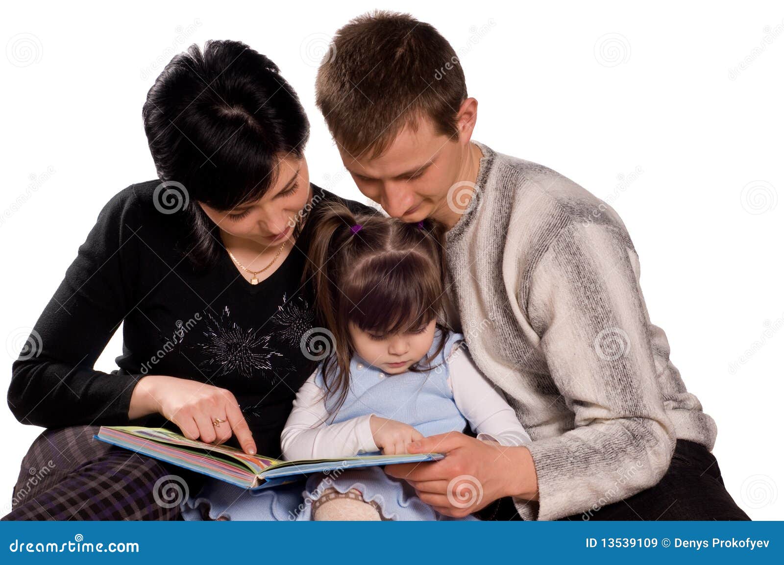 Happy Family Reading a Book Stock Image - Image of happiness, leisure ...