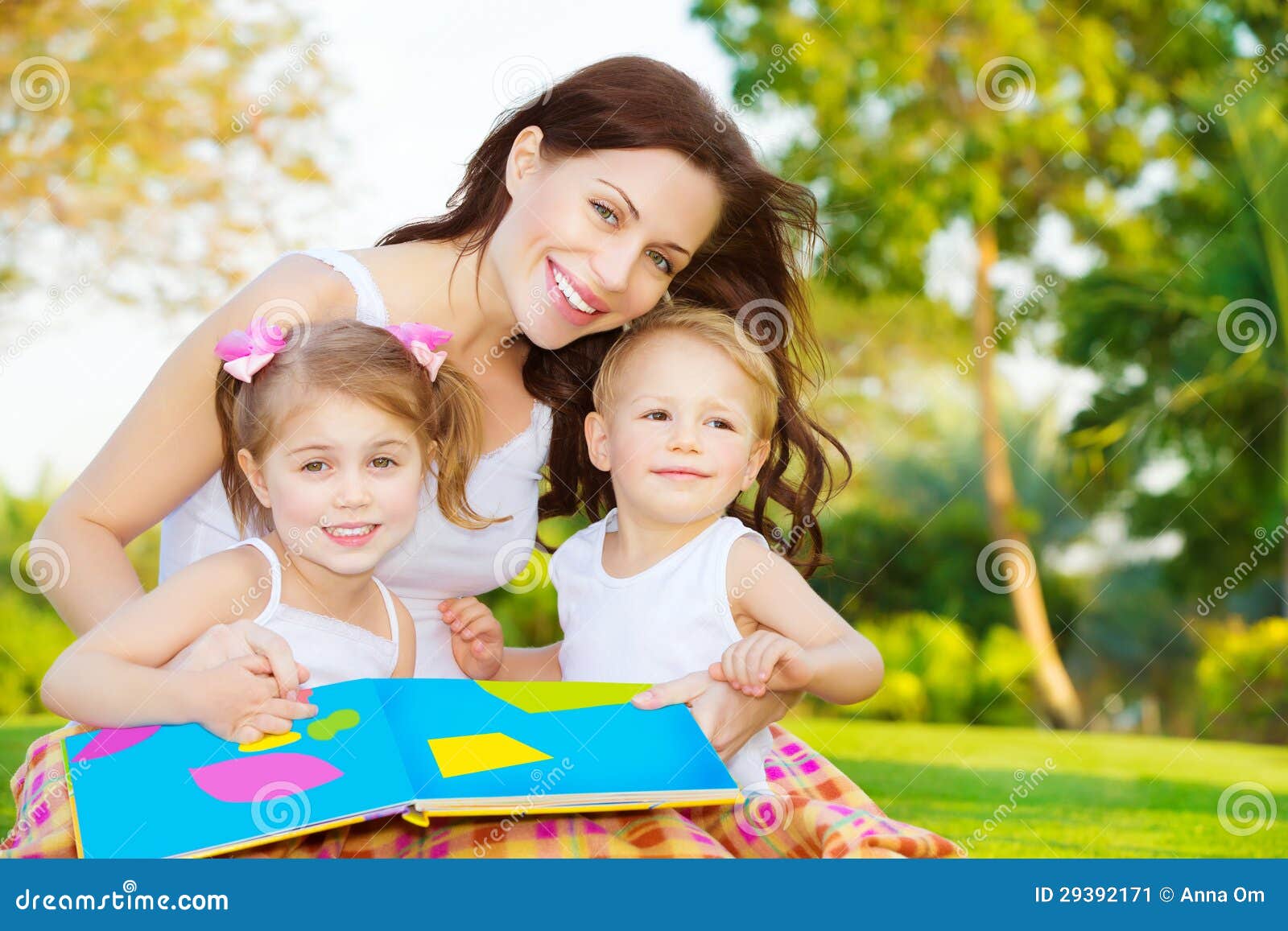 Happy family reading book stock image. Image of infant - 29392171