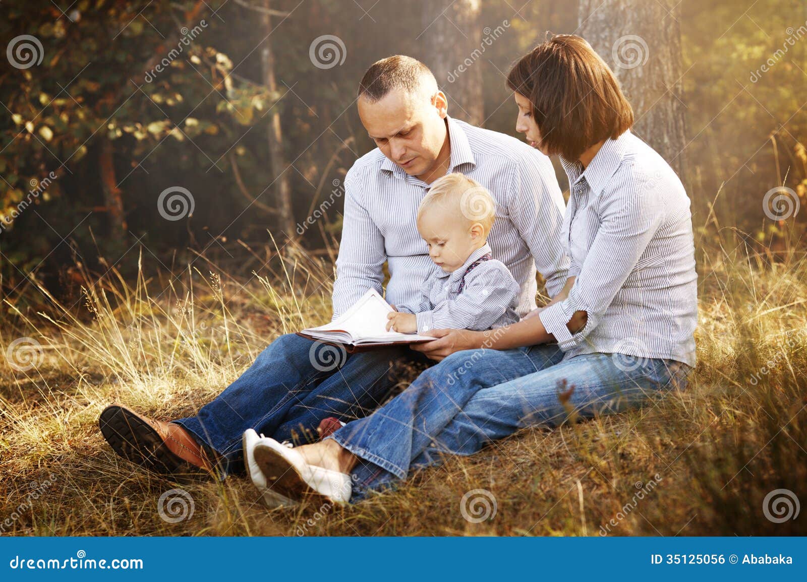 Happy family reading book stock photo. Image of love - 35125056